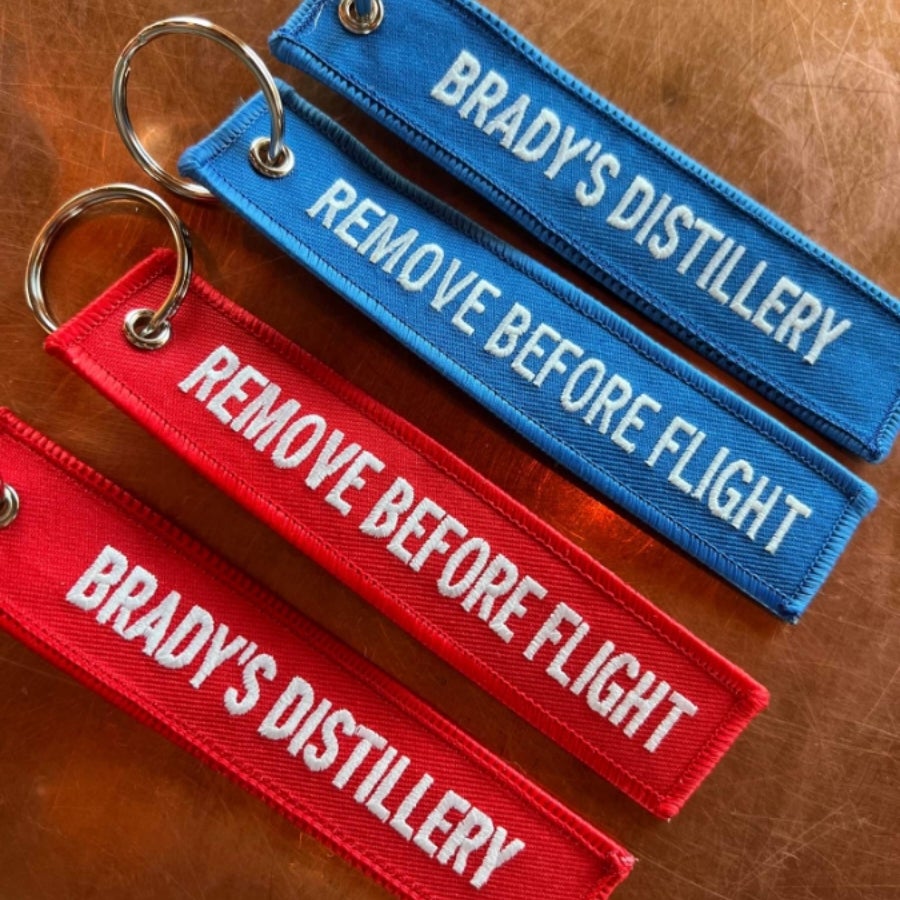 Remove Before Flight Keychain | Brady's Distillery